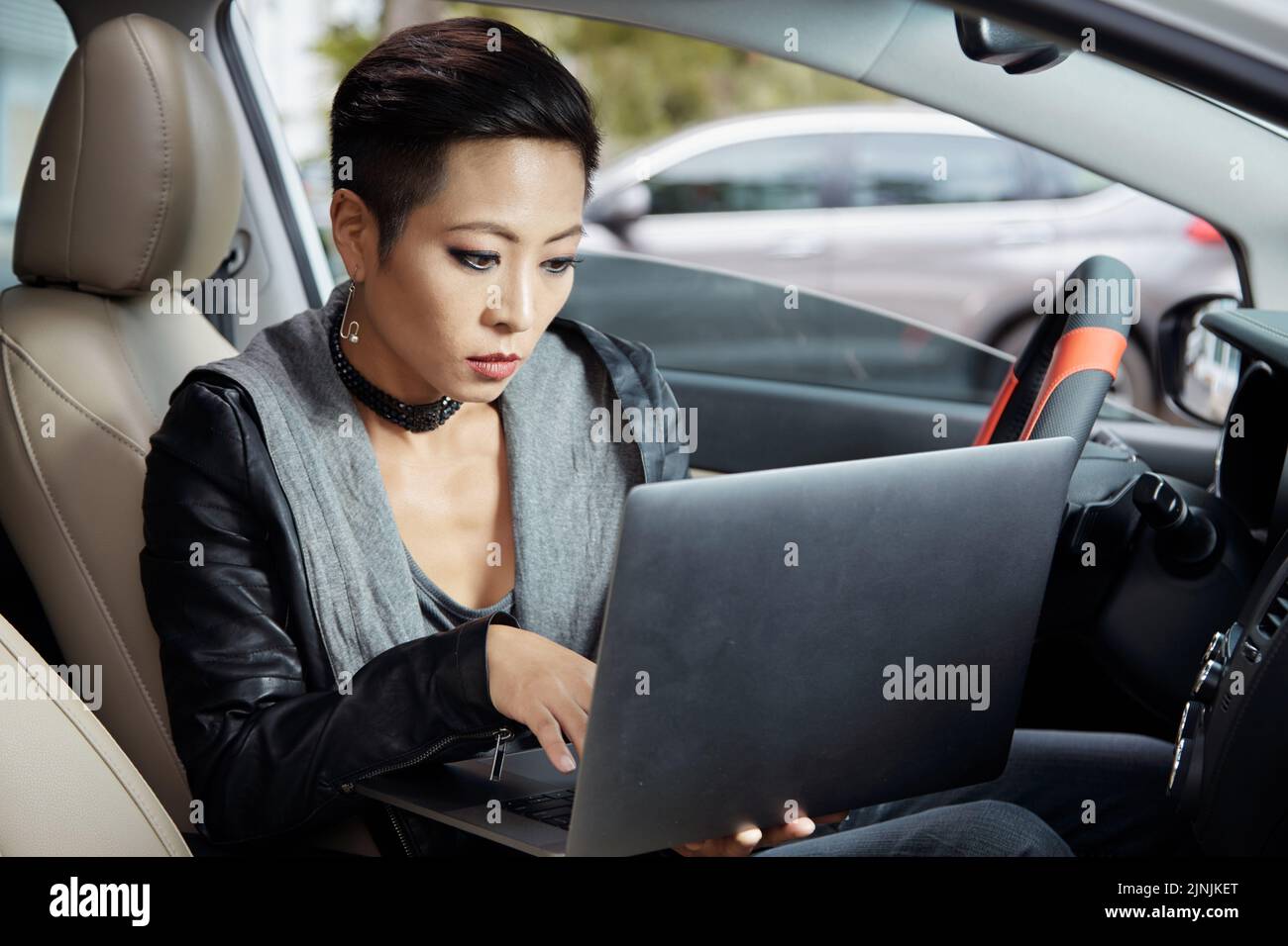 Asian woman sitting in driver hi-res stock photography and images - Alamy