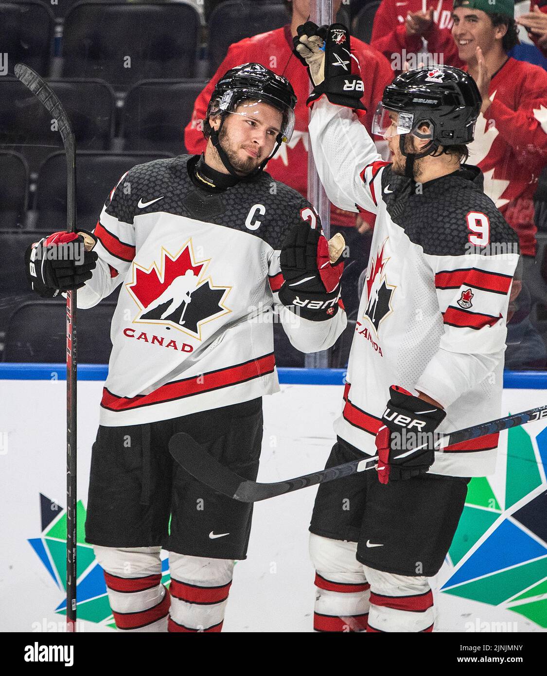 Canada's Mason McTavish (23) and Joshua Roy (9) celebrate a goal ...