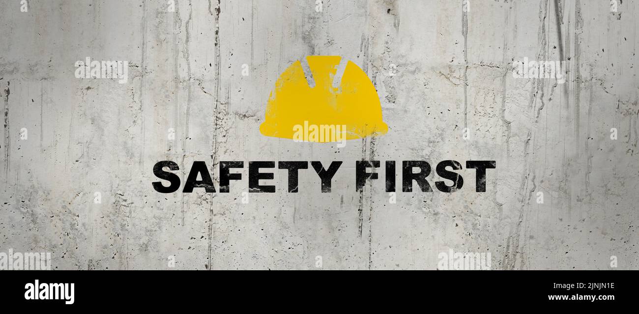 safety first sign on wall background Stock Photo - Alamy