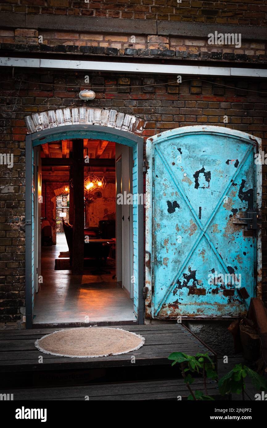 Beautiful entry to a gin bar in industrial environment Stock Photo - Alamy