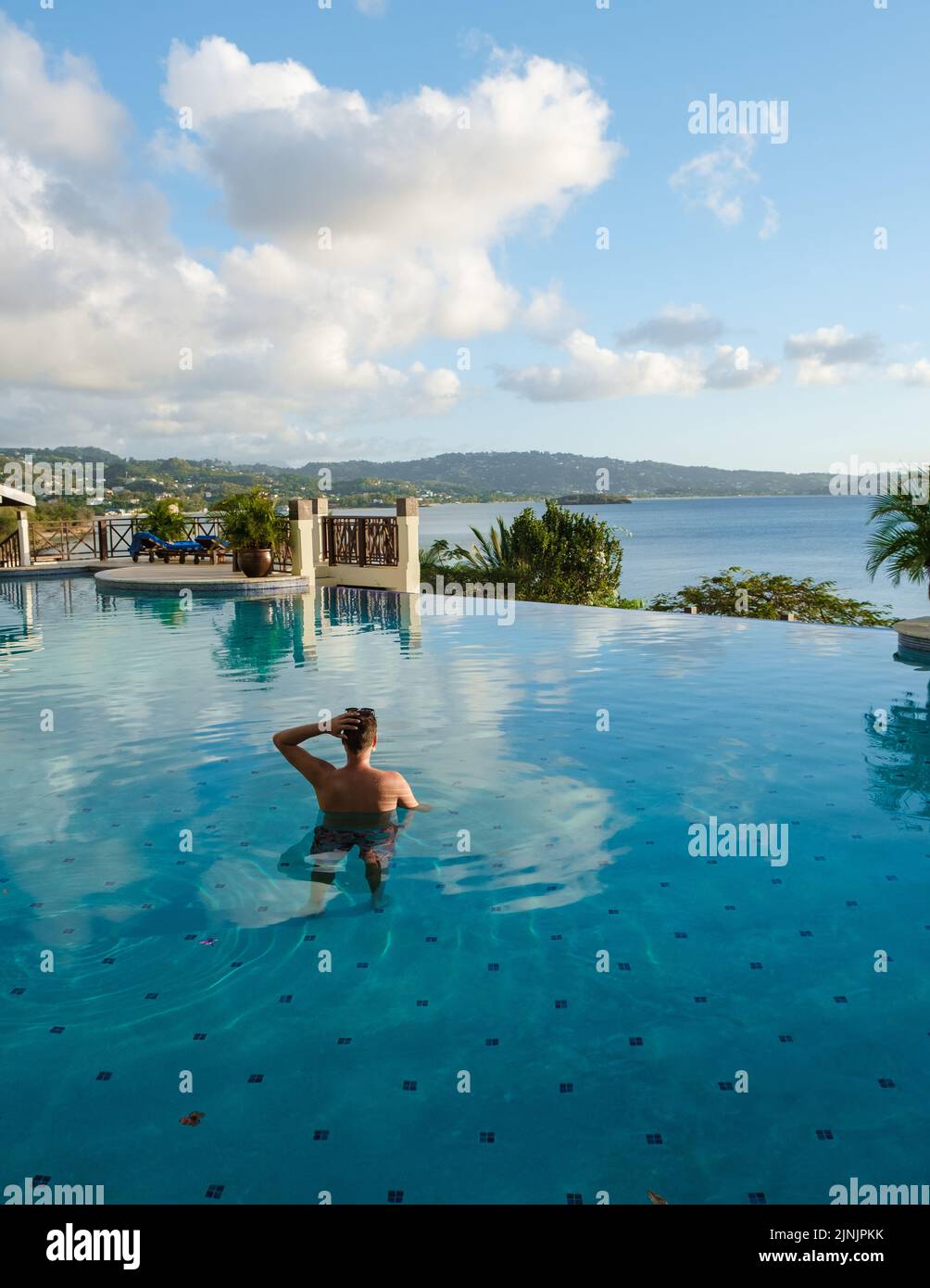 Young men in a swim shorts at Saint Lucia Caribbean, men at infinity ...