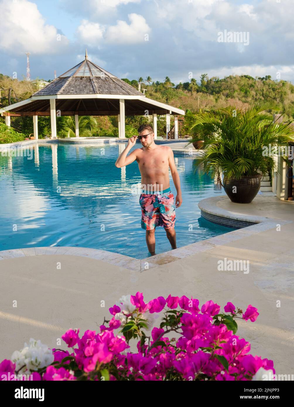 Young men in a swim shorts at Saint Lucia Caribbean, men at infinity ...