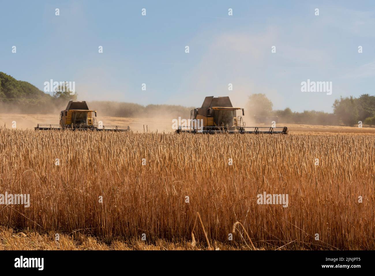 The Cotswolds, Gloucestershire, England, UK. 2022. Two combine ...