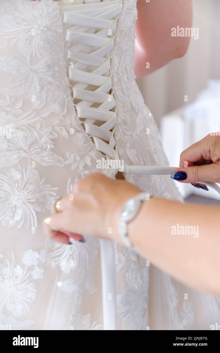 Dressing of the bride hi-res stock photography and images - Alamy