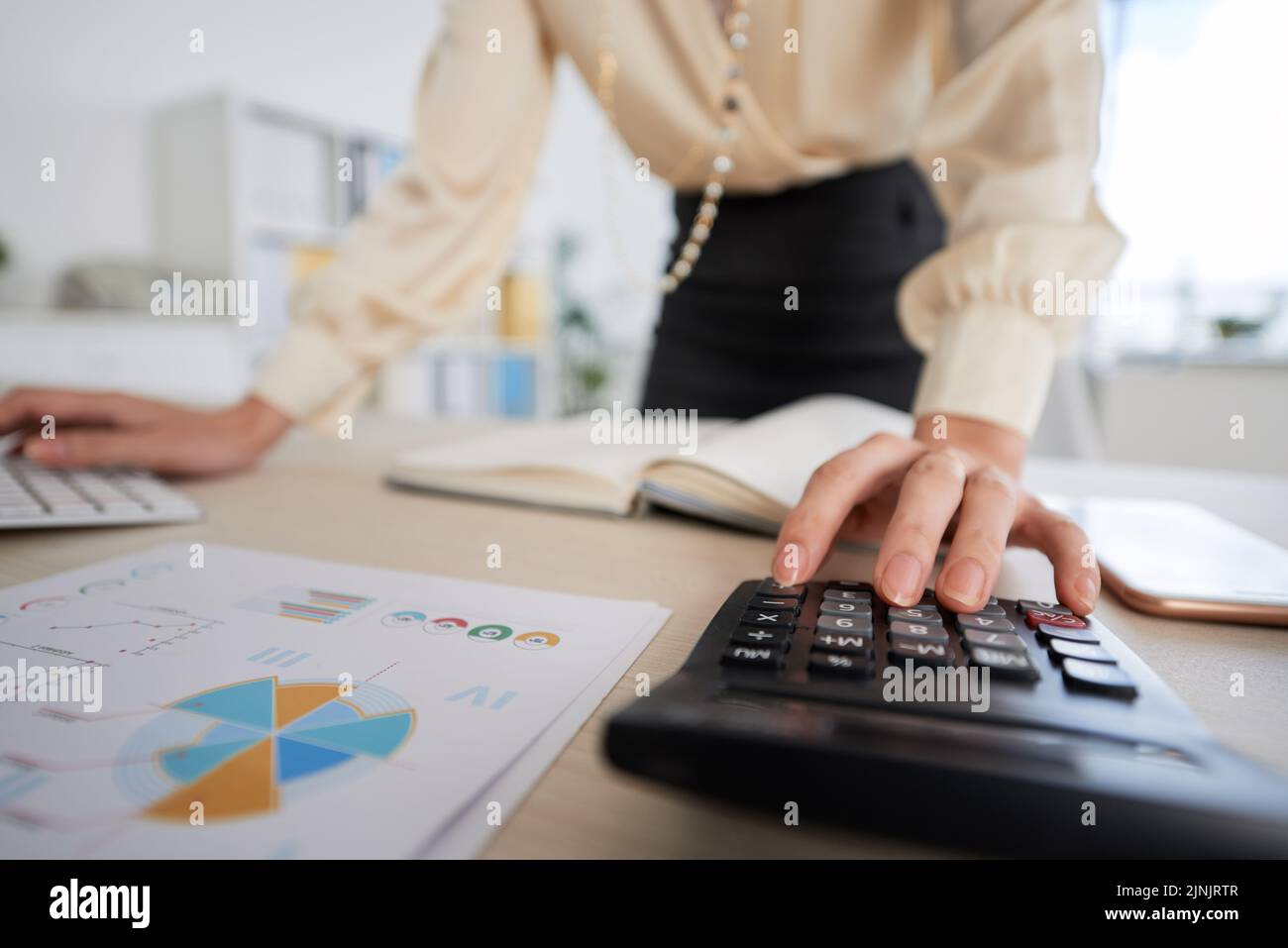 Business lady calculating revenue hi-res stock photography and images ...