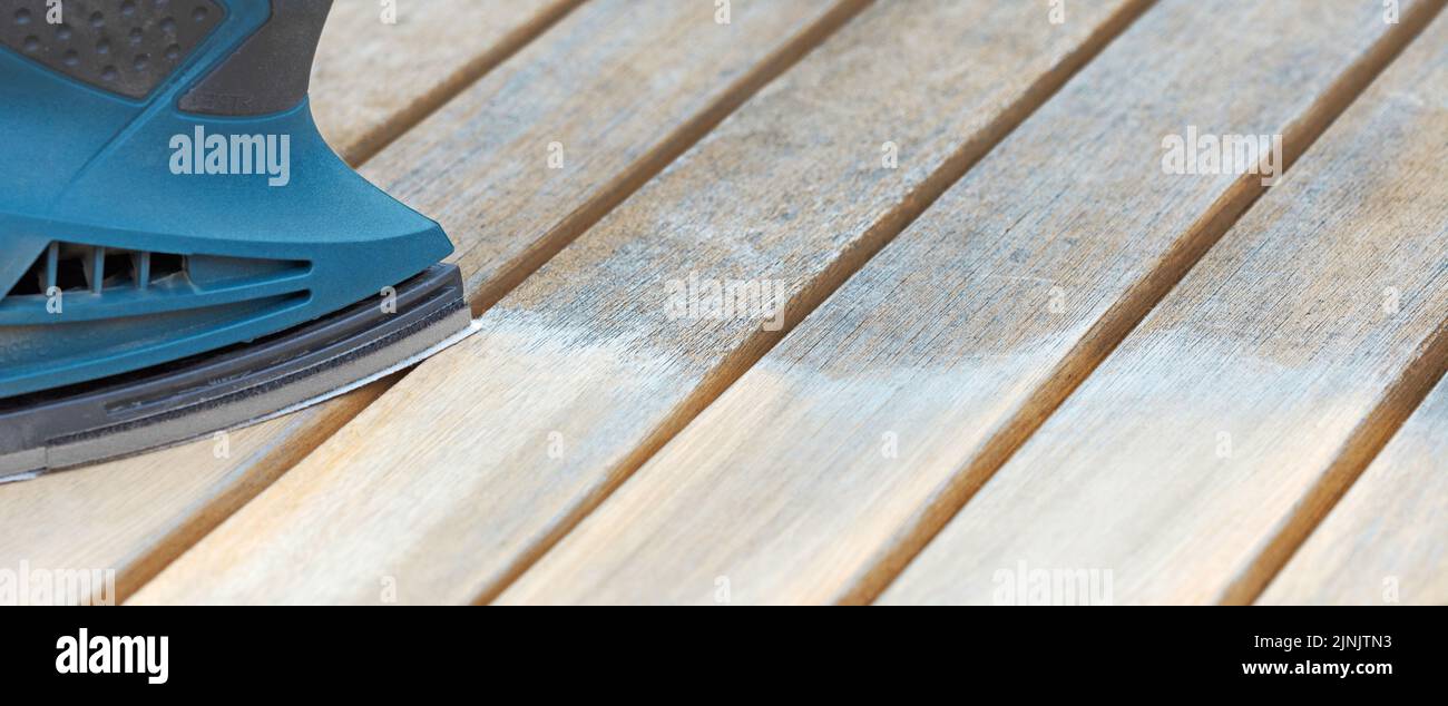 Sand down wooden furniture with a sanding machine in banner format ...
