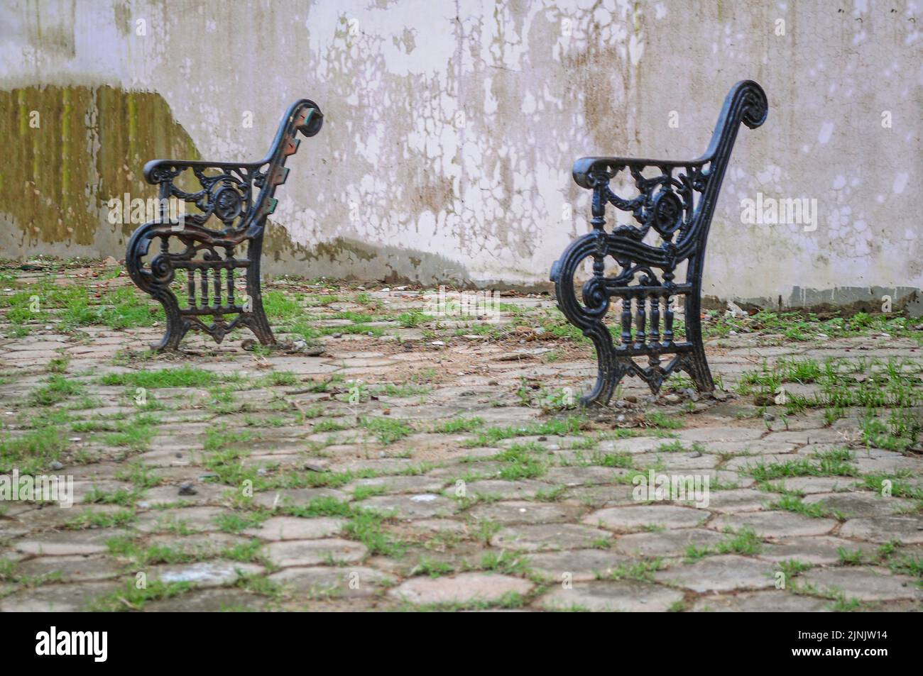 Broken Bench with only armrests in a park without people Stock Photo ...