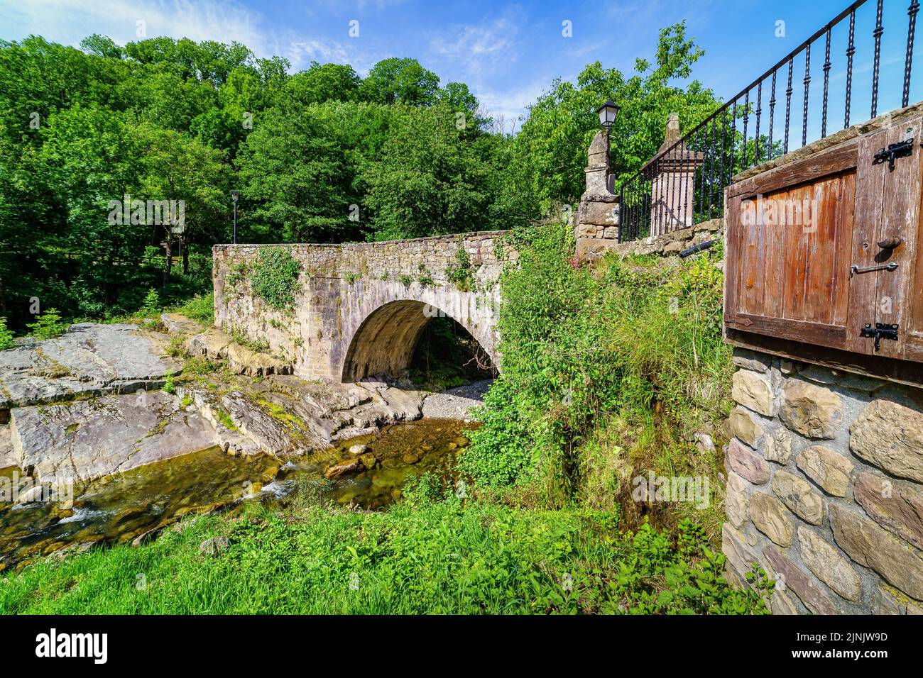 Stone bridge above mountain water stream Stock Photo - Alamy