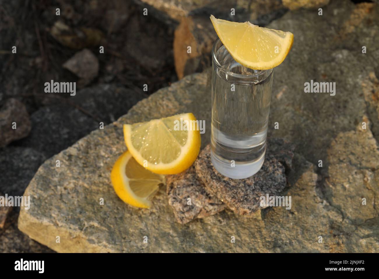 glass of alcohol drink with stone background Stock Photo - Alamy