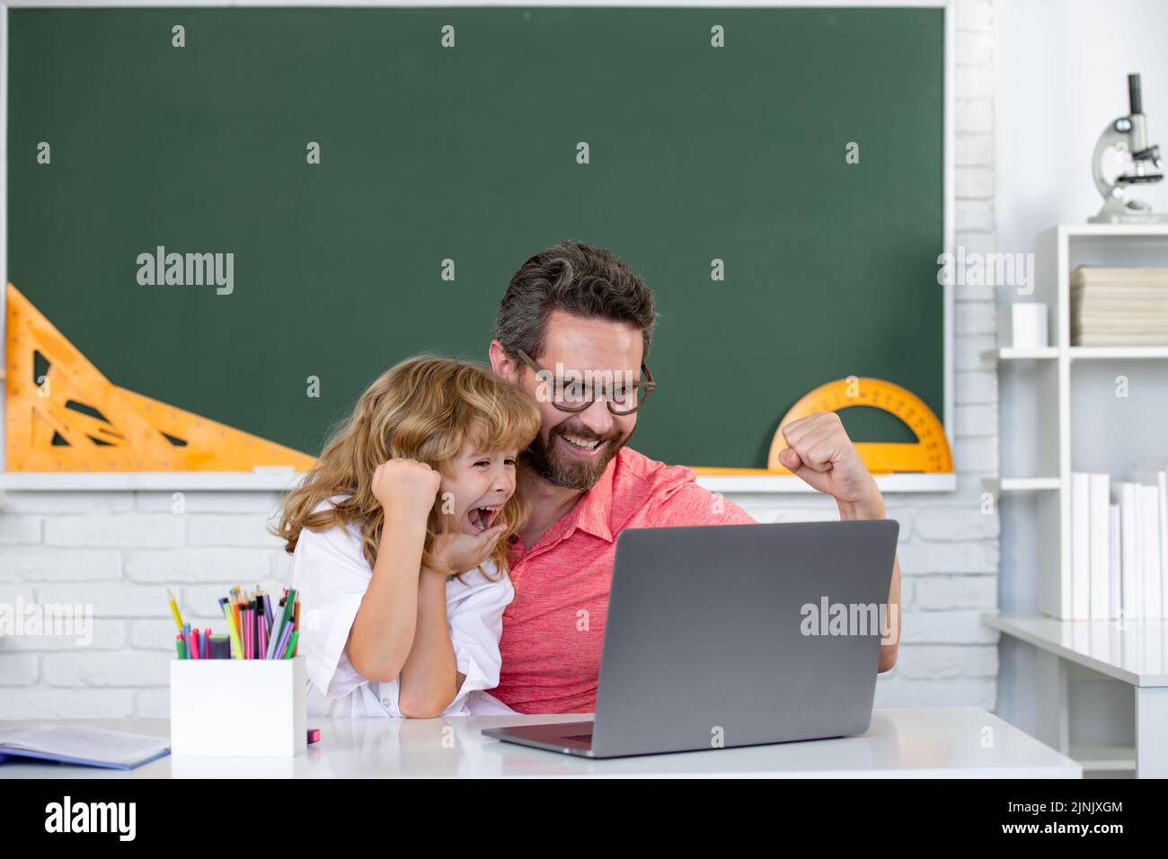 Kid boy learning with teacher. Funny little boy study with father in ...