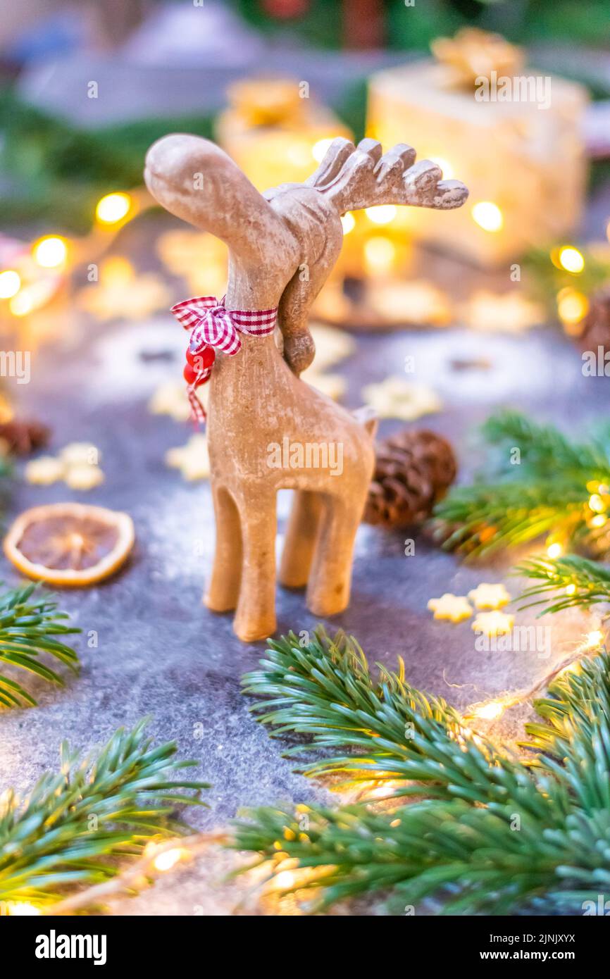 Christmas reindeer wooden toy statue with pine tree, cone and winter ...