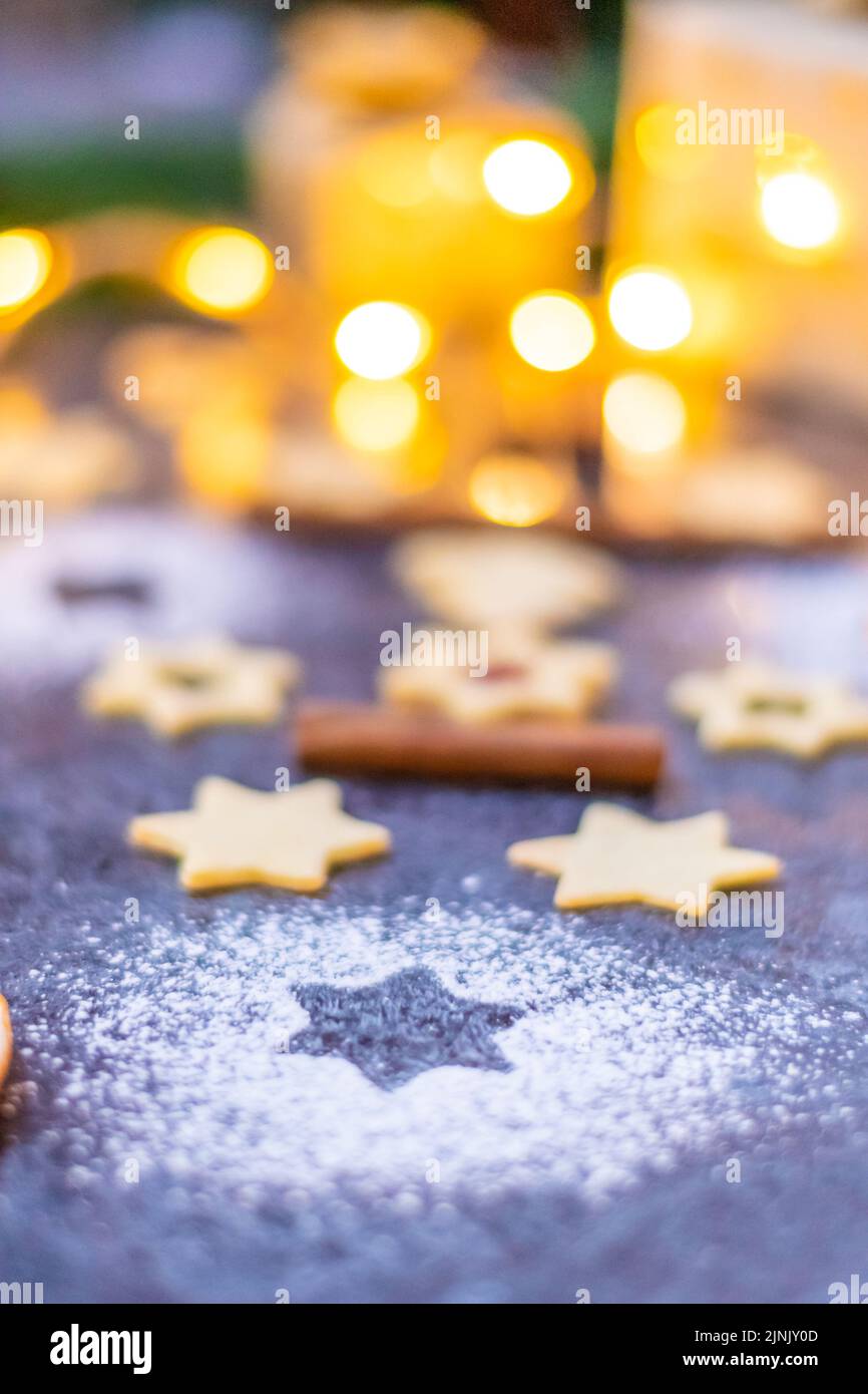Christmas sweets and cookies placed on gray desk. Winter decorations ...