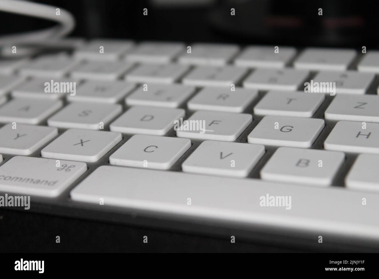 A closeup of the keys of a white simple keyboard of a computer Stock ...