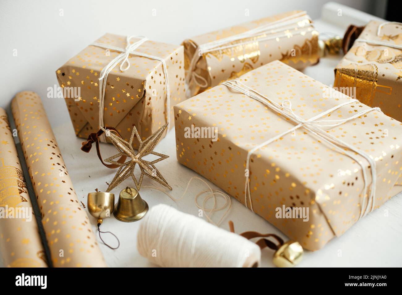 Stylish golden christmas gifts. Modern wrapped christmas gift boxes ...