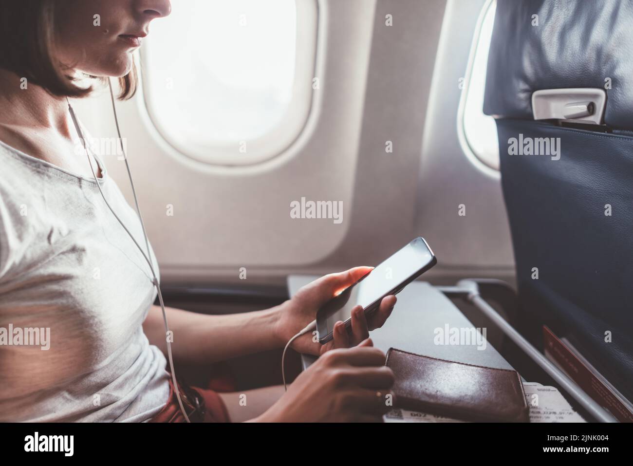 Hand holding smartphone in aircraft hi-res stock photography and images ...