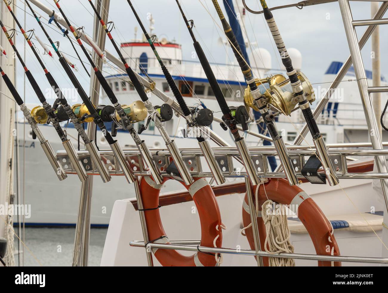 Fishing rods prepared on the rail of a yacht Stock Photo - Alamy