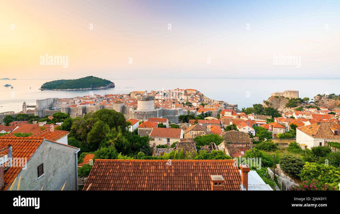 Panoramic view of sunrise over old town of Dubrovnik. Ancient city wall ...
