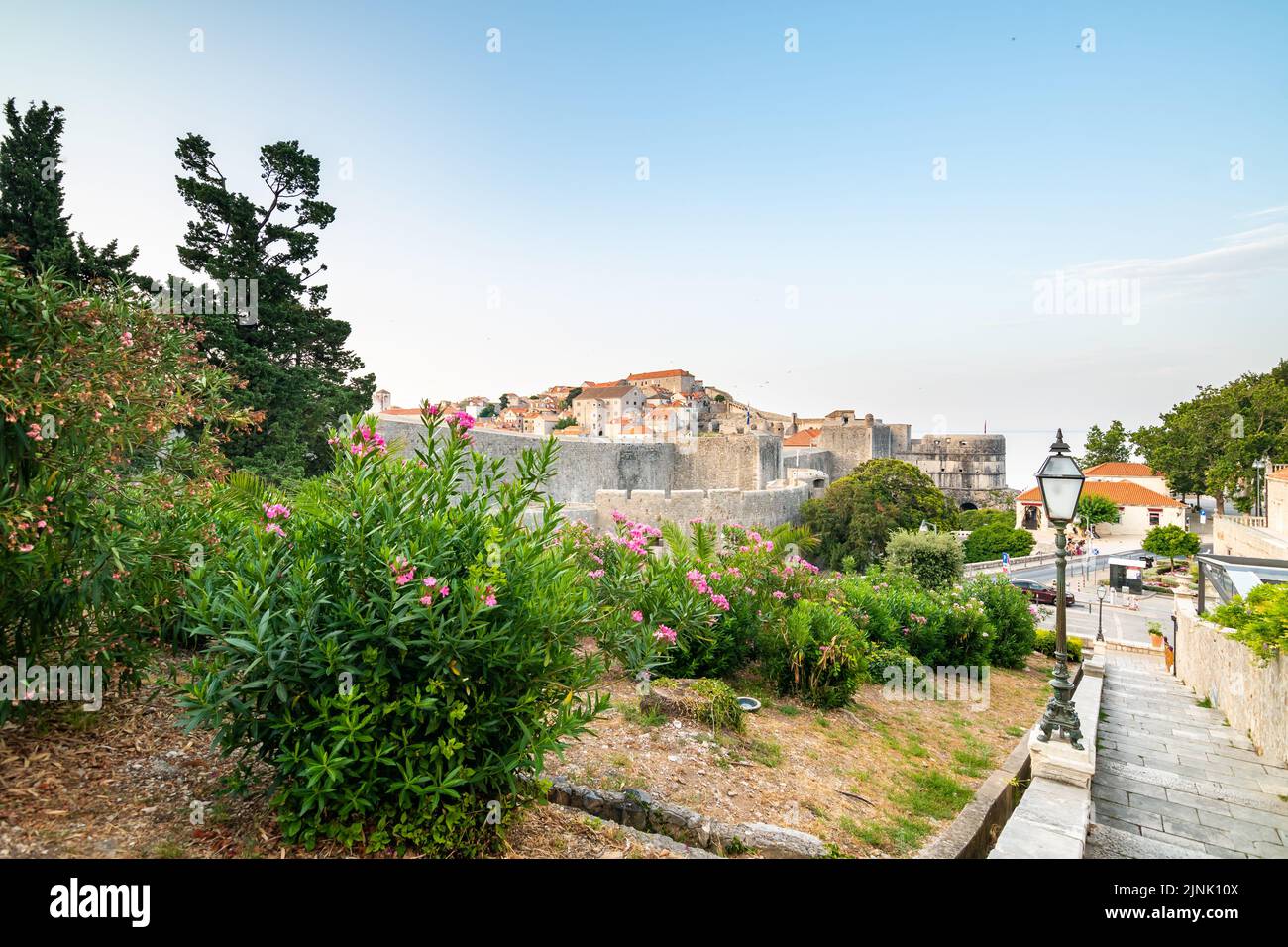Panoramic view of sunrise over old town of Dubrovnik. Ancient city wall ...