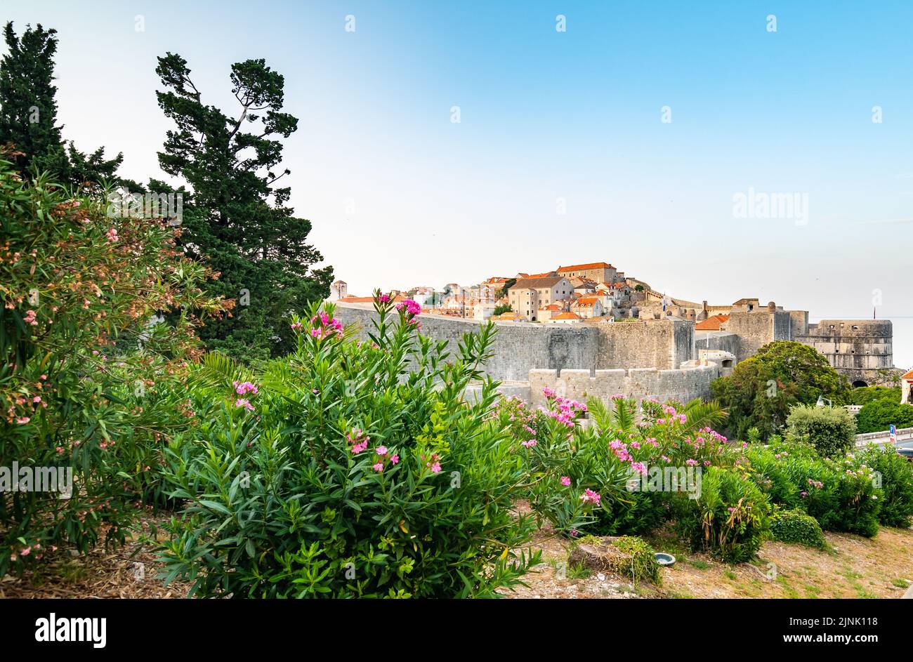 Panoramic view of sunrise over old town of Dubrovnik. Ancient city wall ...