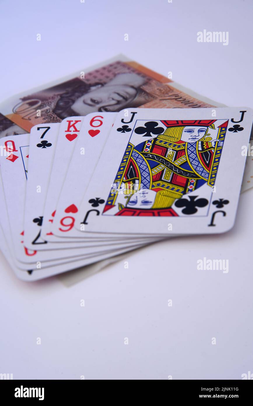 Playing cards and cash Stock Photo - Alamy