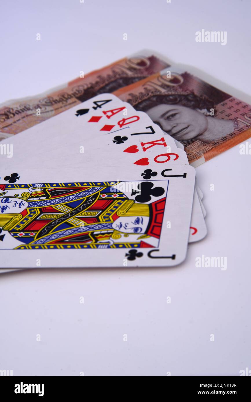 Playing cards and cash Stock Photo - Alamy
