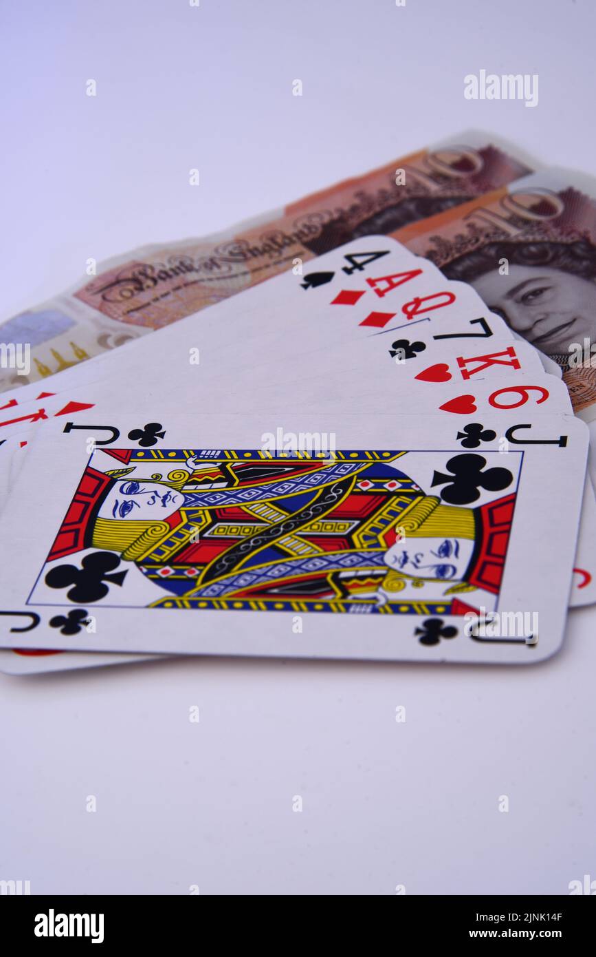 Playing cards and cash Stock Photo - Alamy