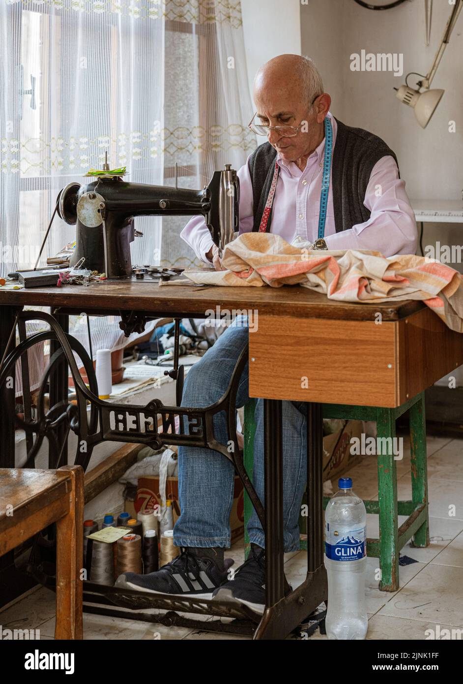 Albania, May 12, 2022 - man works at tread-powered sewing machine Stock ...