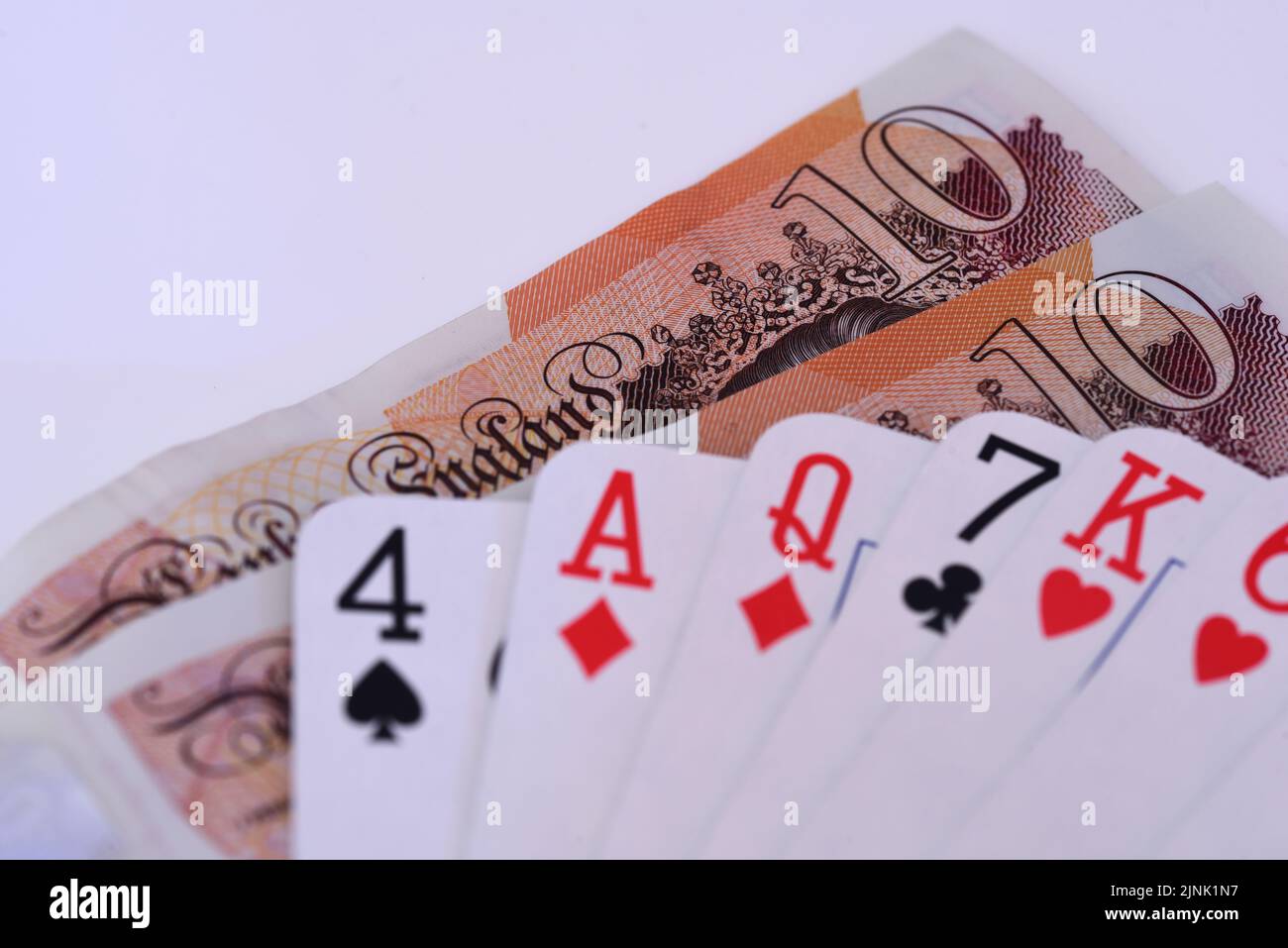 Playing cards and cash Stock Photo - Alamy