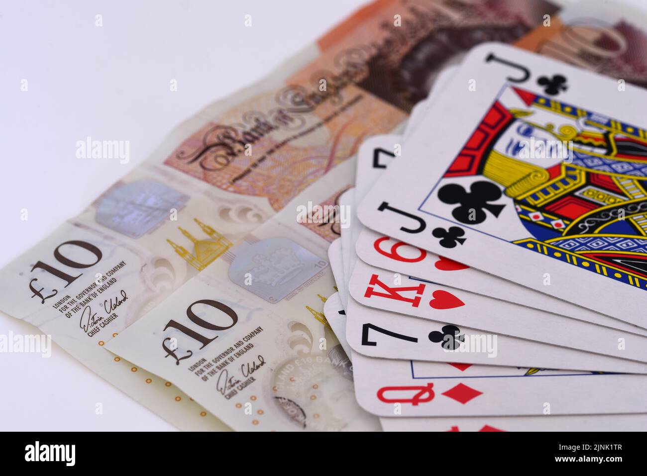 Playing cards and cash Stock Photo - Alamy