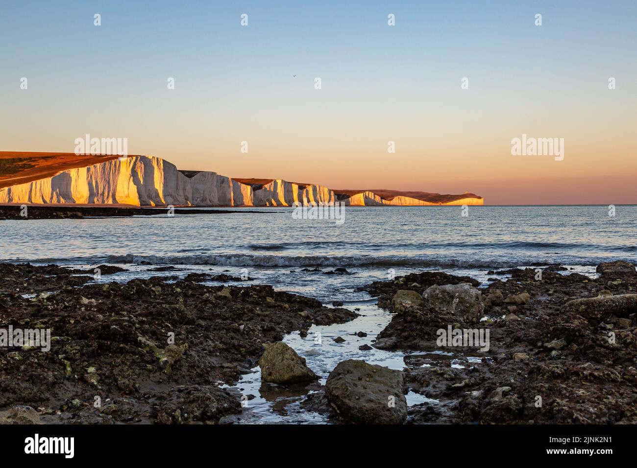The rocky beach at Hope Gap on the Sussex coast, with a view of the ...
