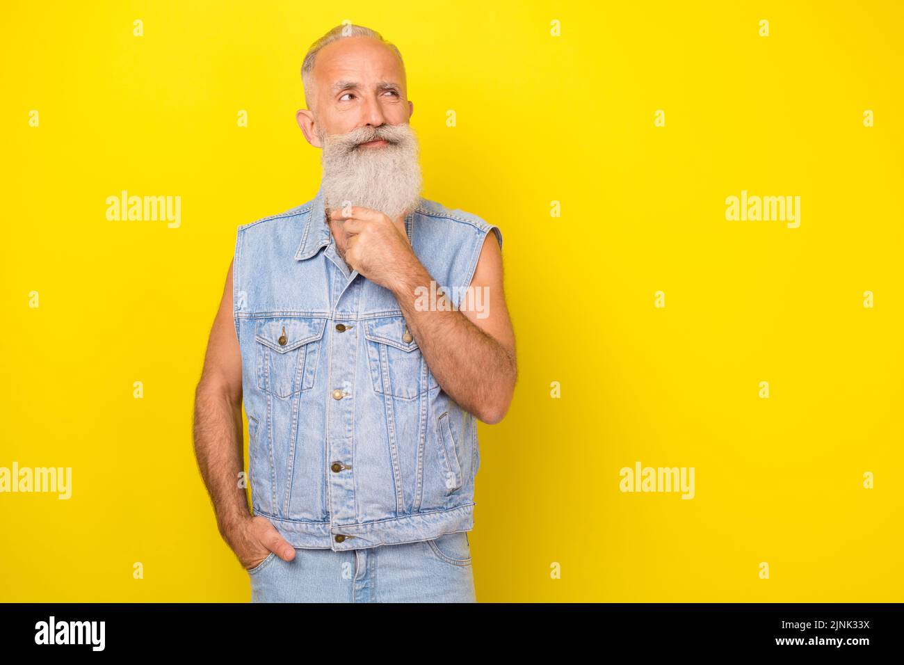 Photo of pretty thoughtful man pensioner dressed denim vest hand arm ...