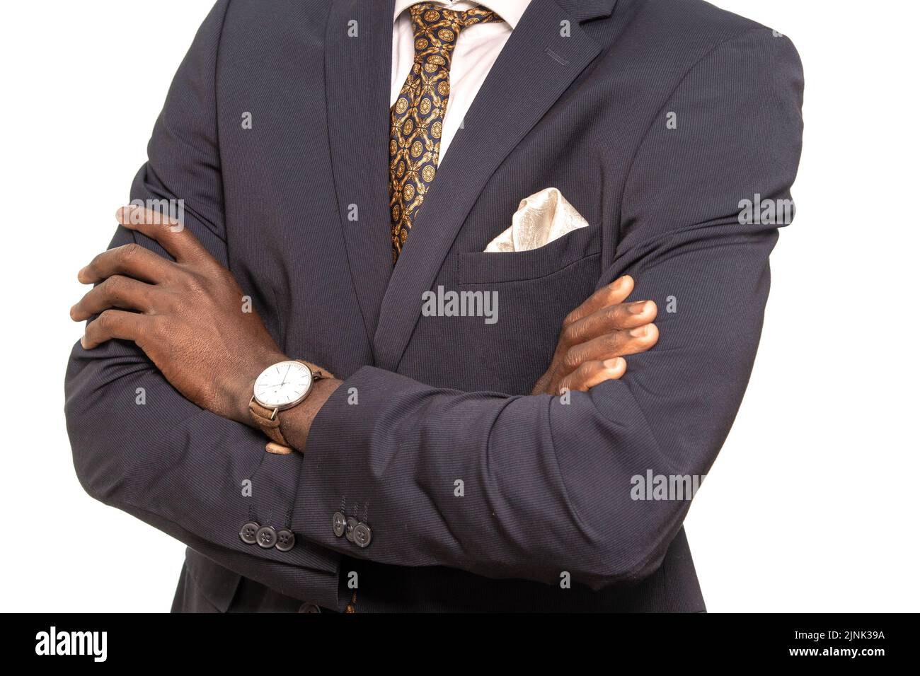 An interracial African ethnicity boss standing with crossed arms in ...