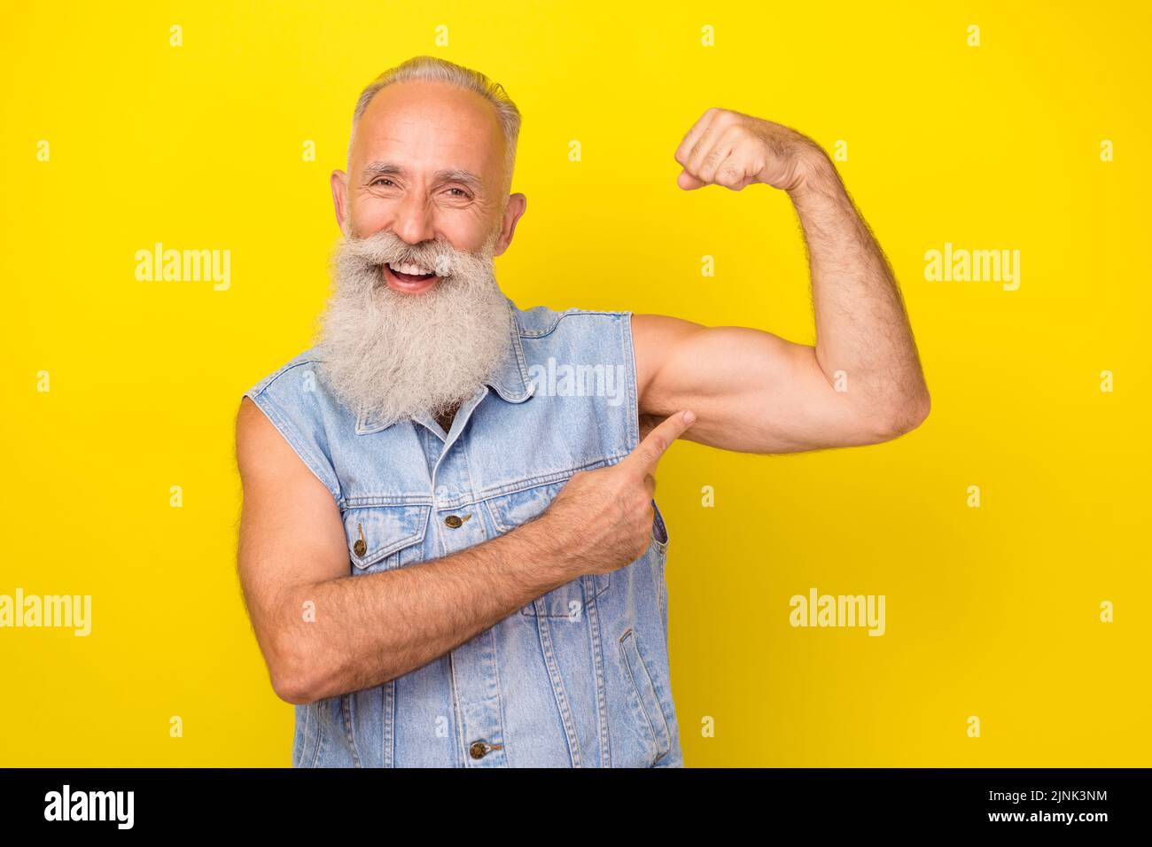 Photo of charming pretty man pensioner dressed denim pointing finger ...