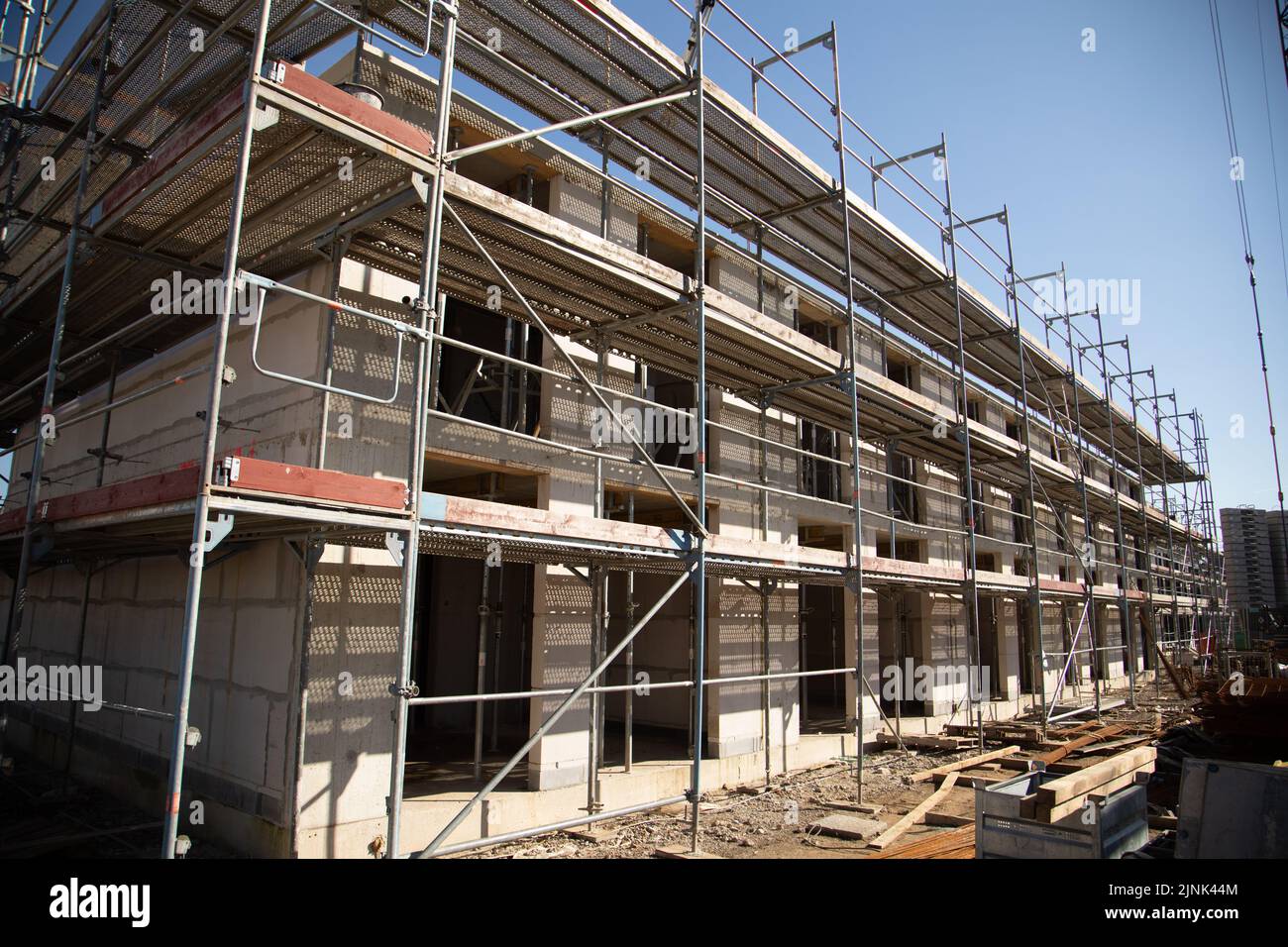 A build of a new house out of concrete with scaffolding next to the ...