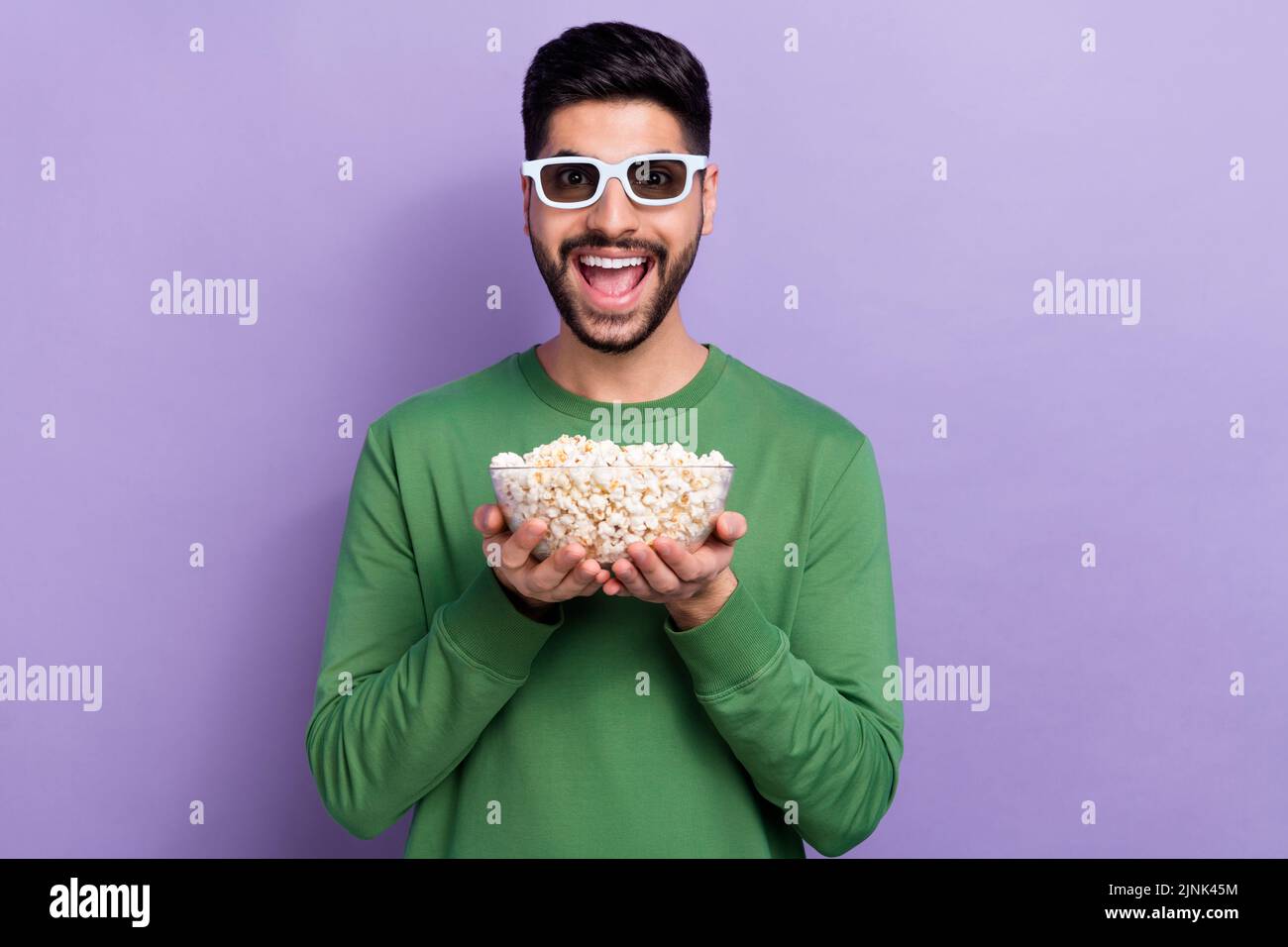 Photo of young impressed astonished open mouth guy hold popcorn in ...
