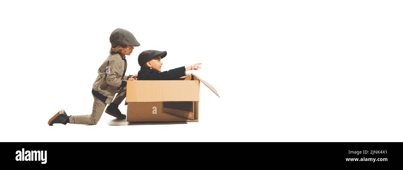 Group of happy children playing together isolated on white studio ...