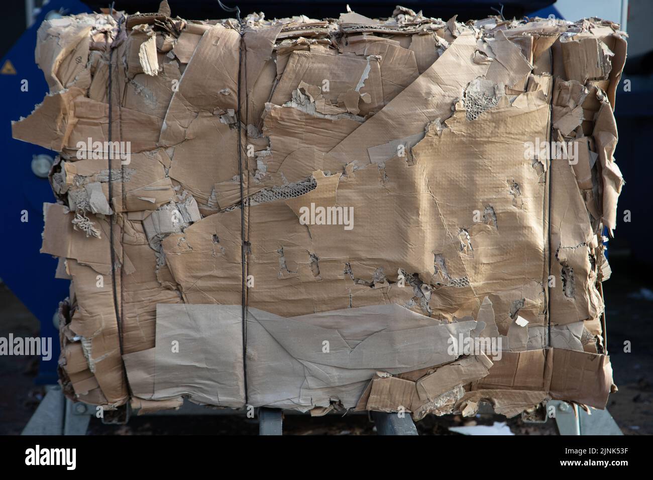 A closeup of pressed brown cardboard boxes ready to get recycled into a ...