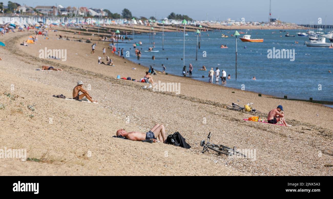 People sunbathing beach hi-res stock photography and images - Alamy