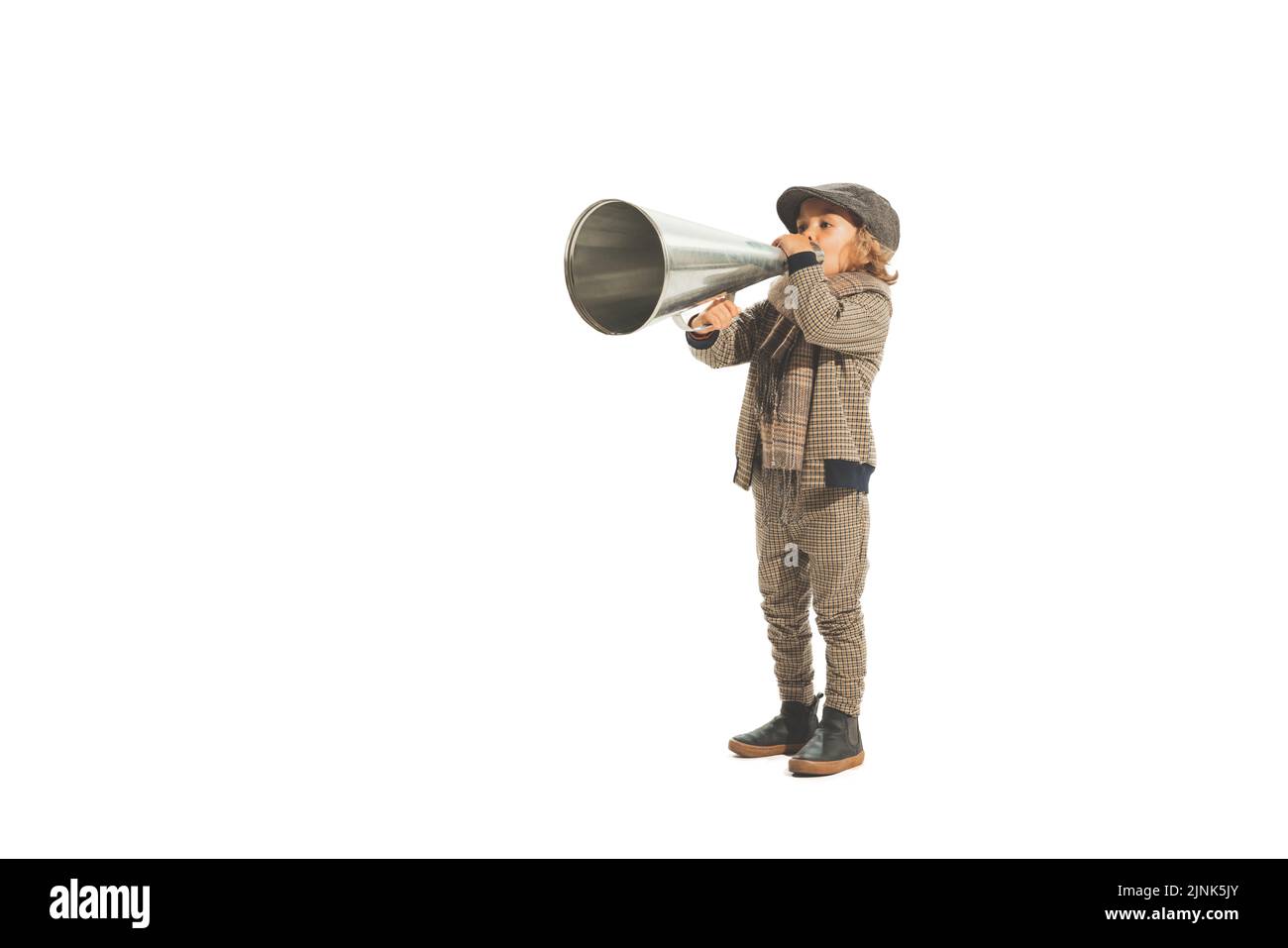 Charming little kid shouting through vintage megaphone. Communication ...