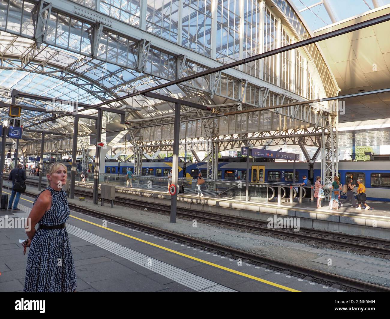Passengers on the covered platform of Salzburg railway station Stock ...