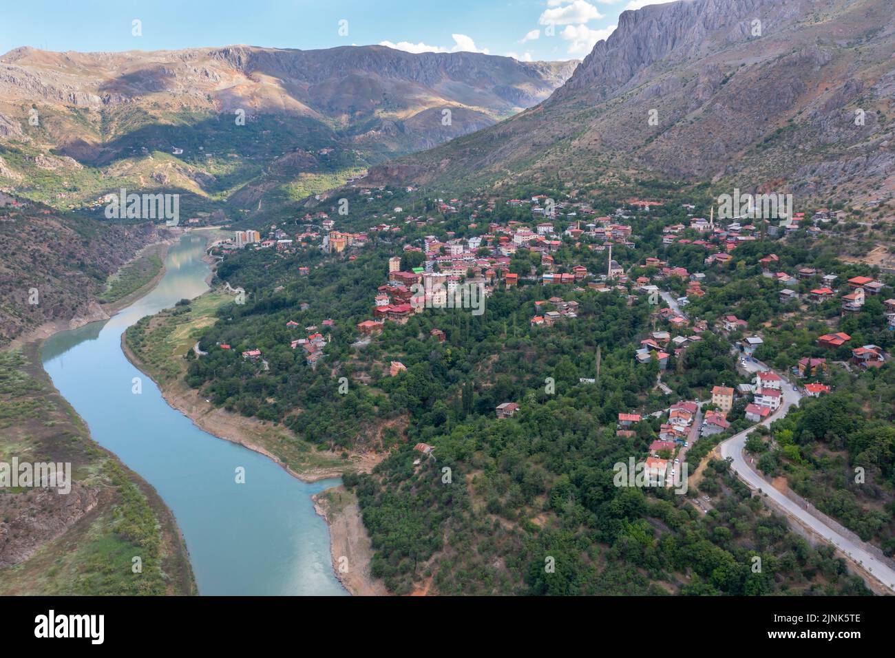 Valley view of Kemaliye town. View of the old Kemaliye houses and the ...