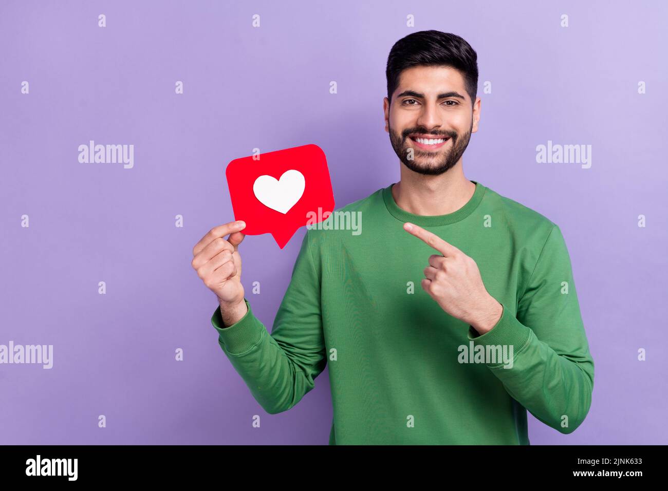 Photo of handsome positive toothy brunet guy wear green long sleeve ...