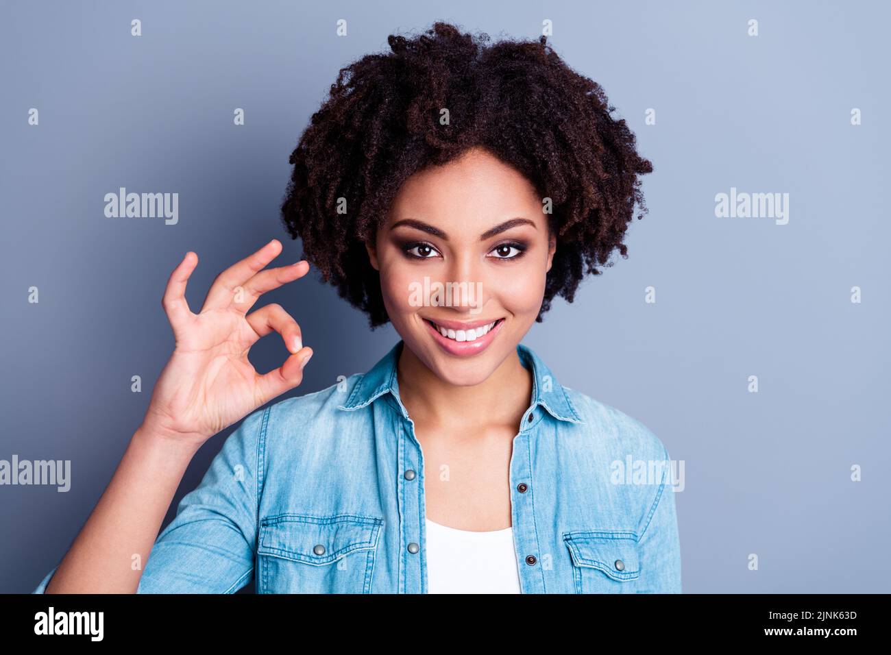 Photo of charming positive person hand fingers show okey symbol ...
