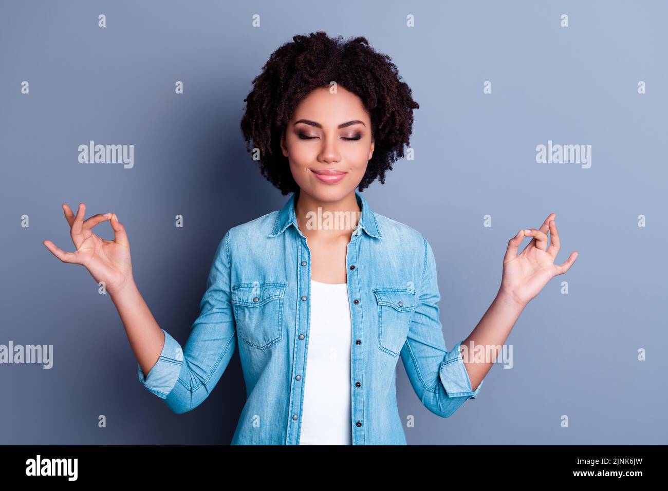 Portrait of charming calm lady closed eyes hands fingers meditate ...