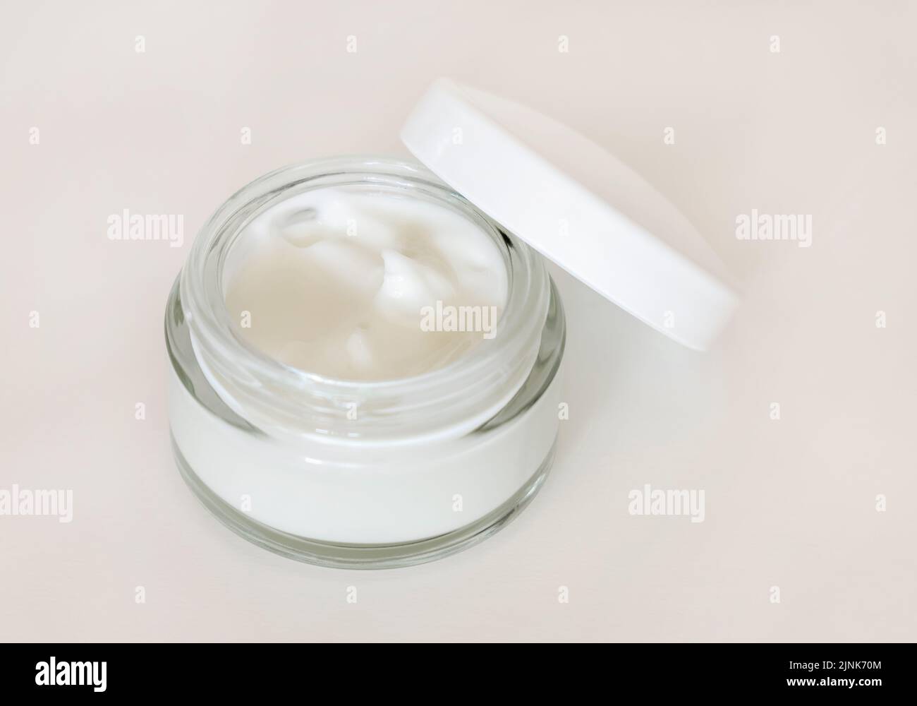 Opened Cosmetic jar with a lid on white close up, mockup. Cosmetic ...