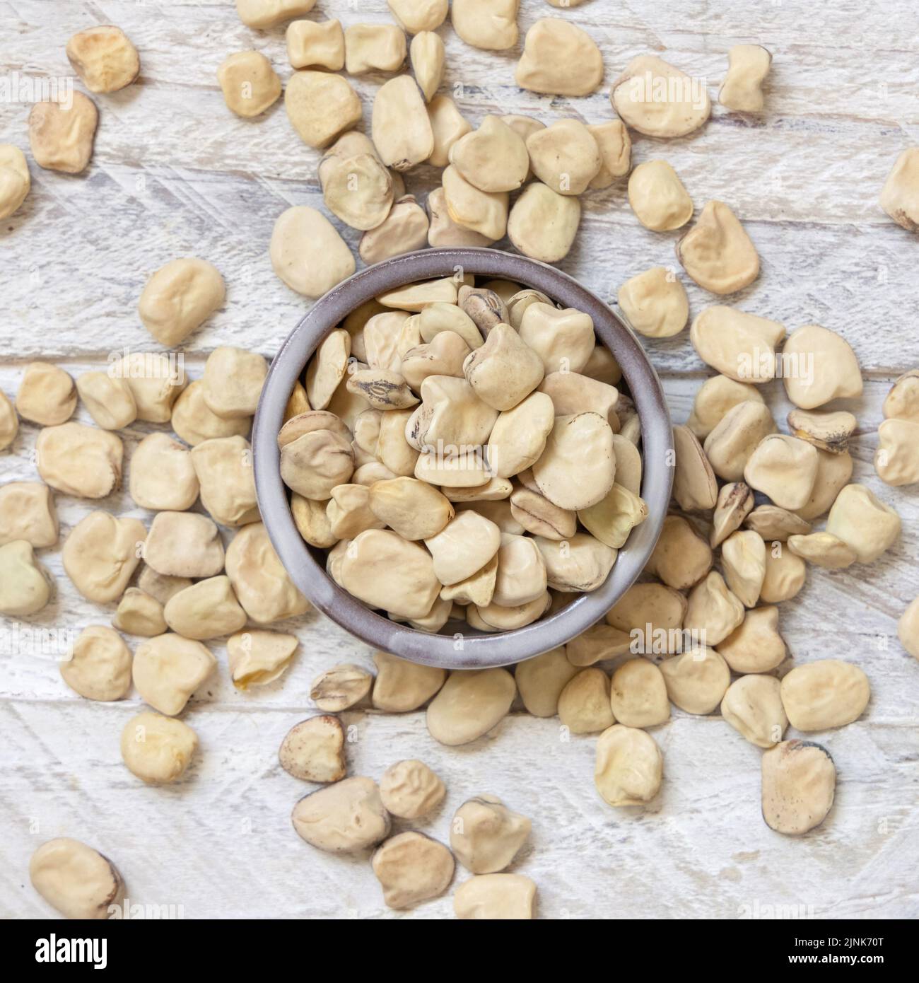 Bowl of raw dry Grass pea on wood top view. Healthy, protein source for ...