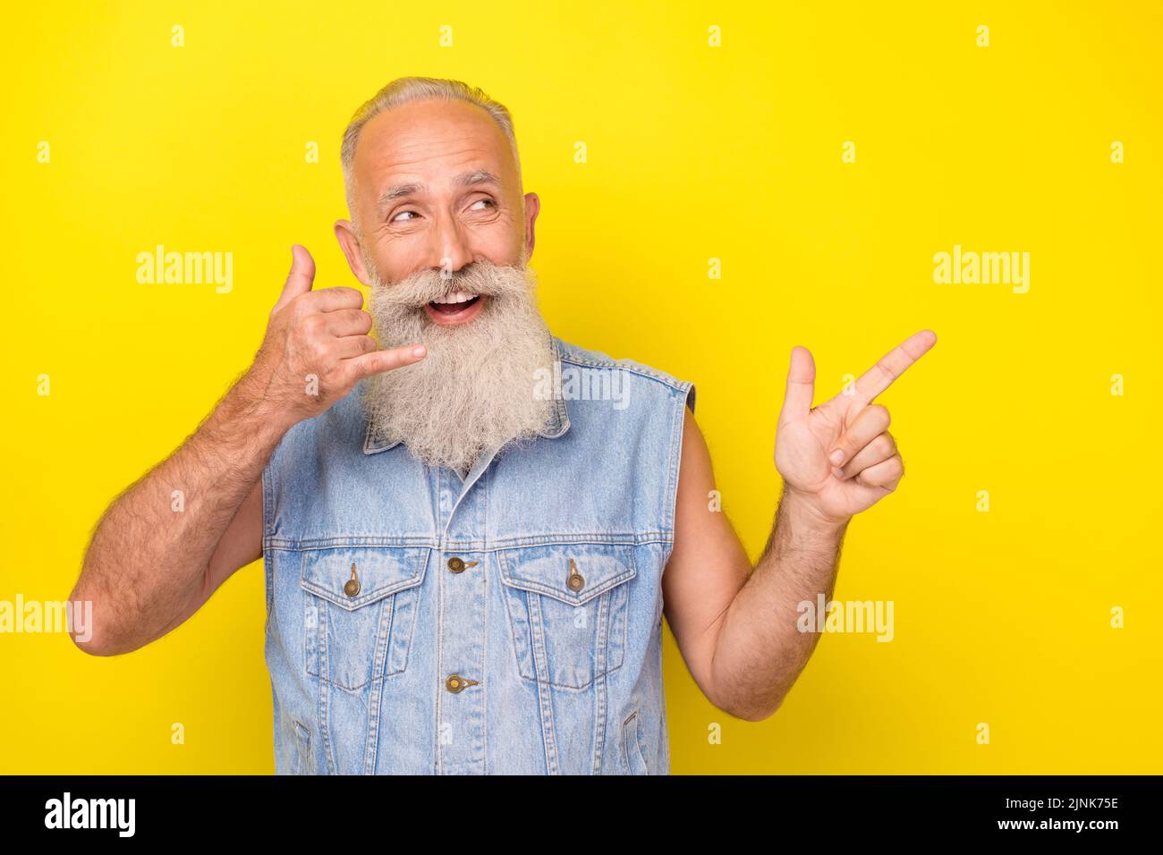 Photo of attractive dreamy man pensioner dressed denim vest showing ...