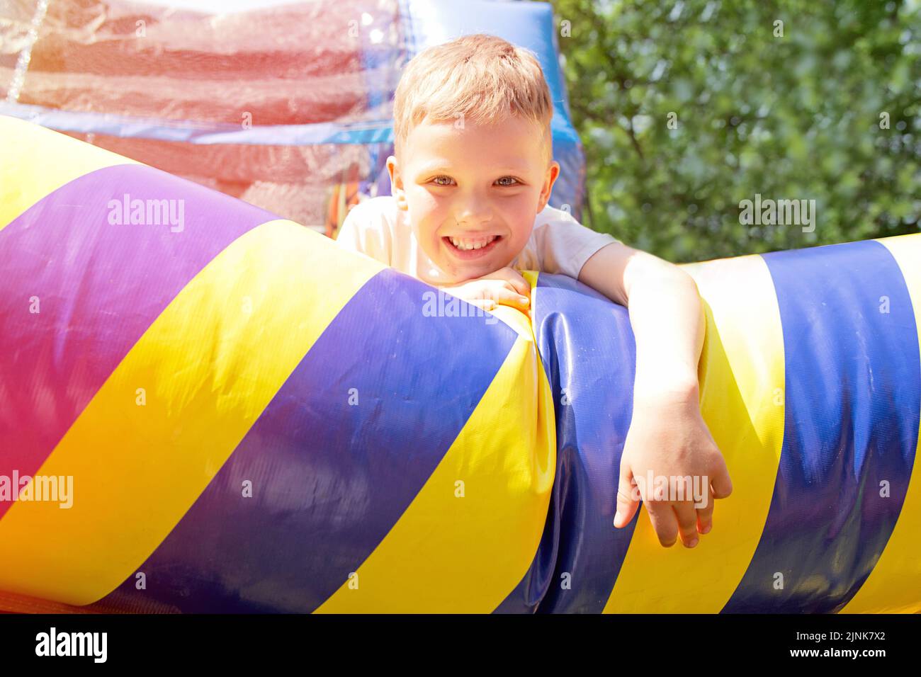 Happy boy on the inflatable trampoline.Family fun concept Stock Photo ...
