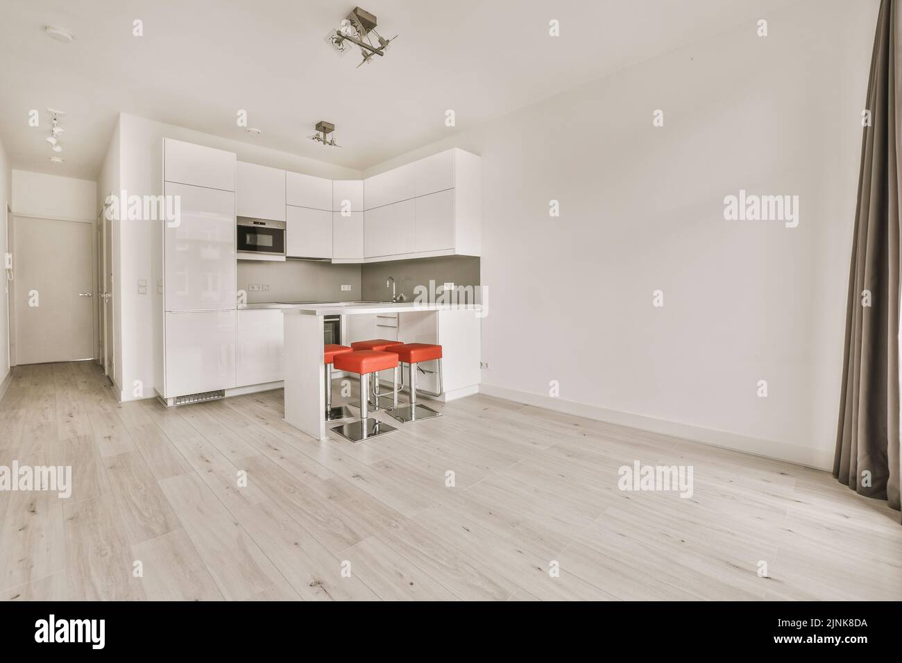 Interior of empty white kitchen with windows and wooden parquet floor ...
