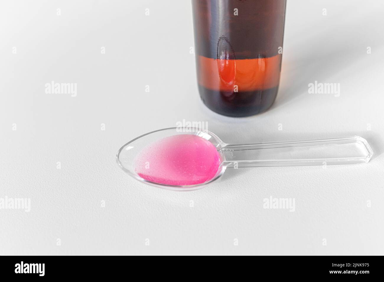 A potion for treatment and a vial of medicine Stock Photo - Alamy